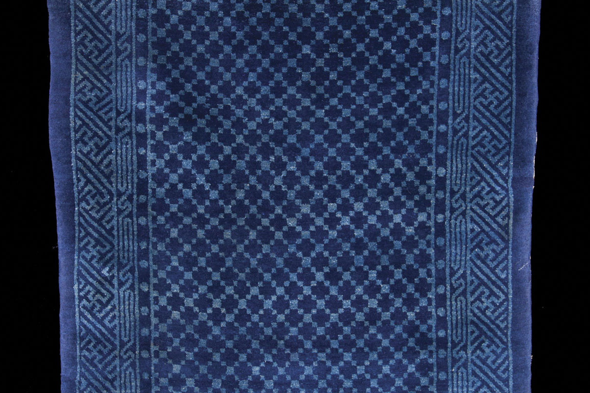 A blue ground Chinese carpet with turquoise key-fret decoration, late ...